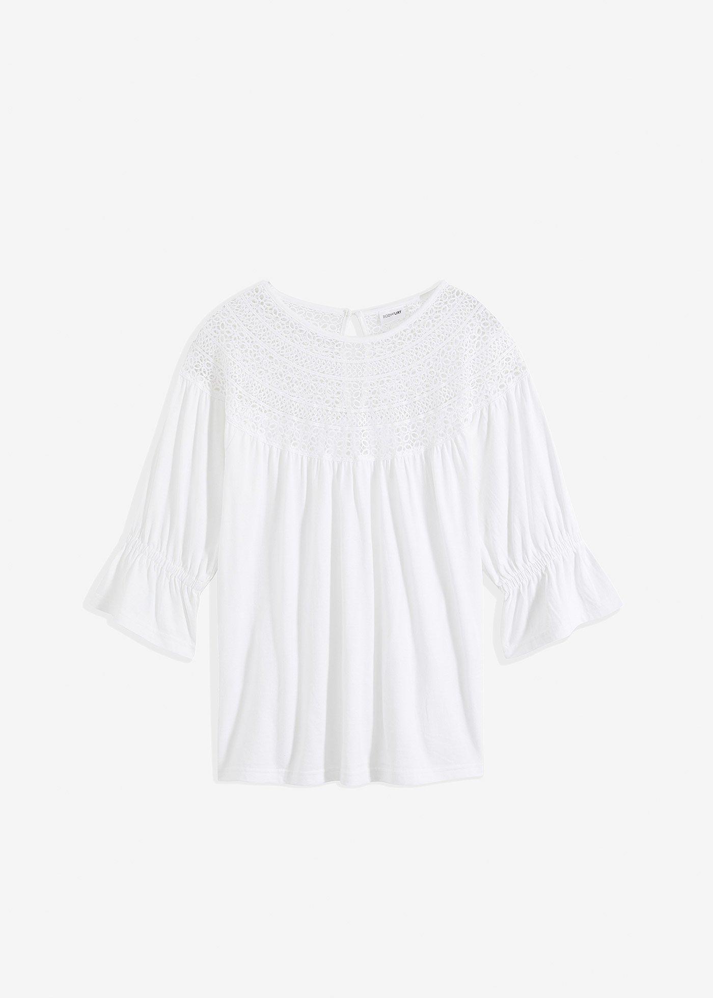 Förtjusande kortärmad 7/8-topp med söt spets i halsringningen - vit